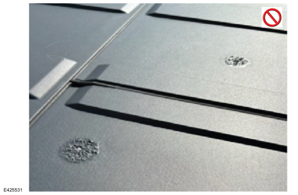 Damage on front header corners (Non-warrantable)